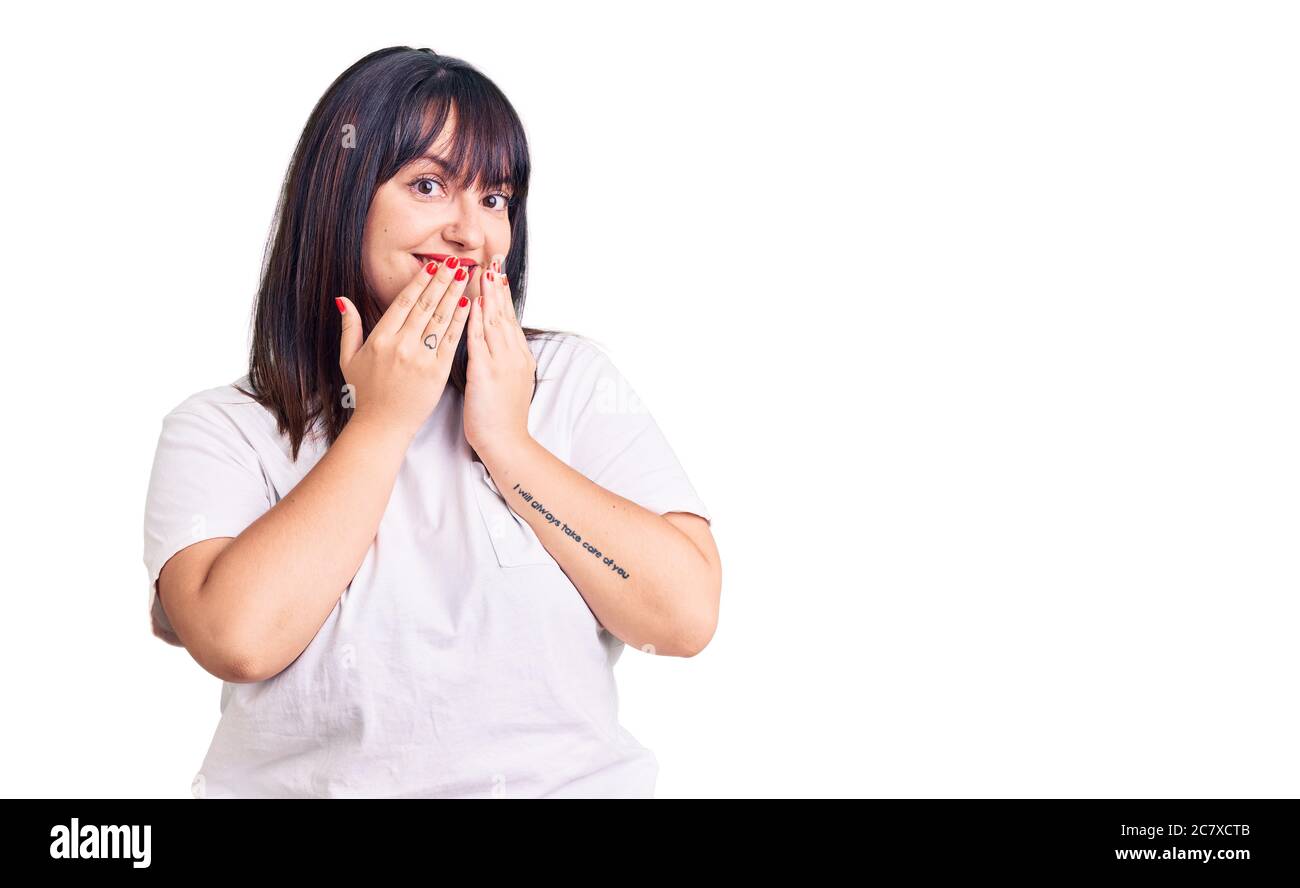 Young plus size woman wearing casual clothes laughing and embarrassed ...