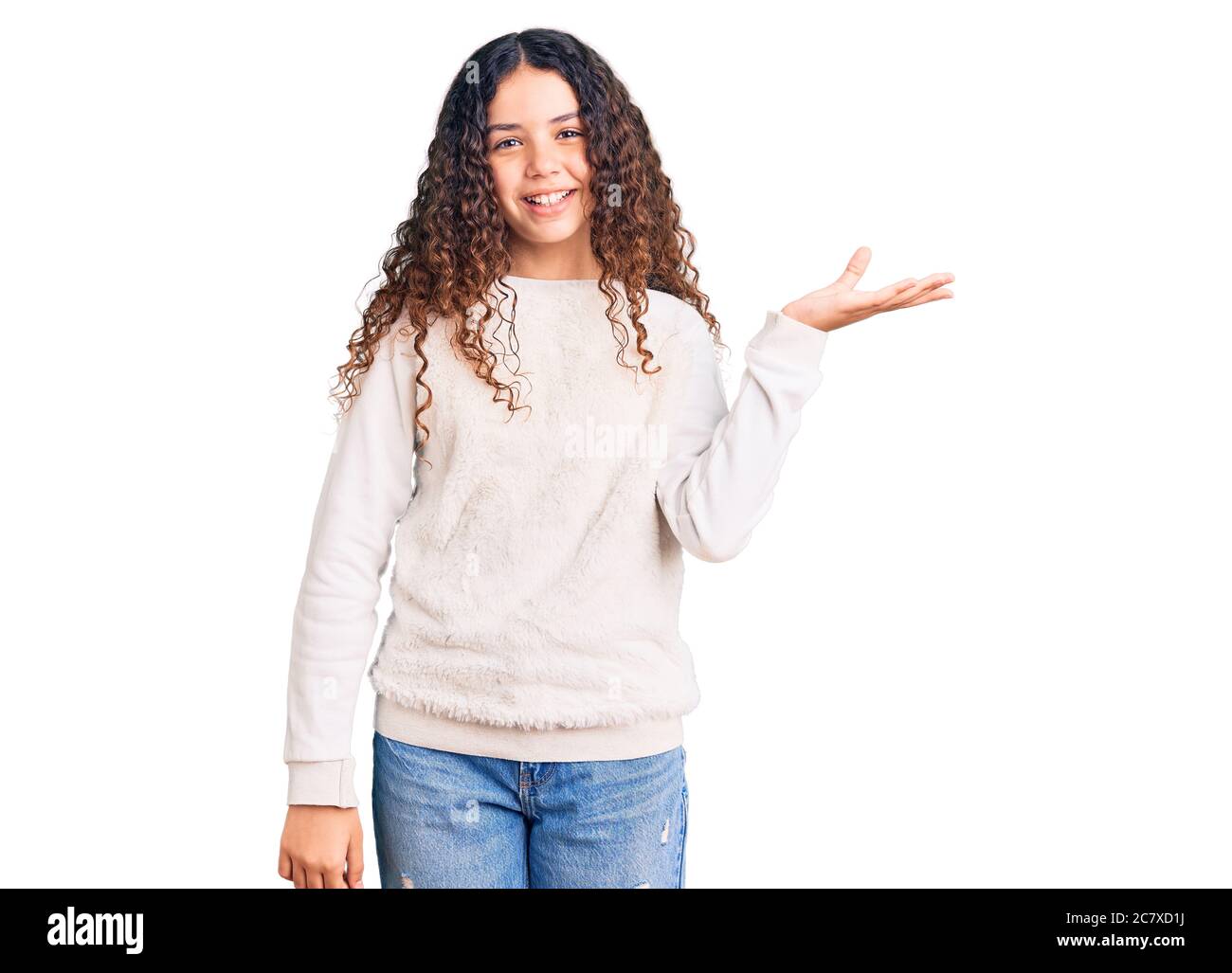 Beautiful kid girl with curly hair wearing casual clothes smiling ...