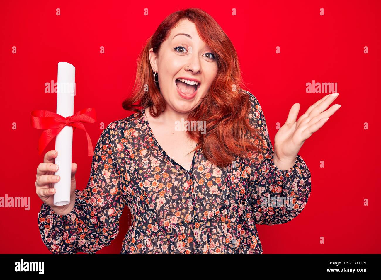 Graduated woman celebrating diploma over hi-res stock photography and ...