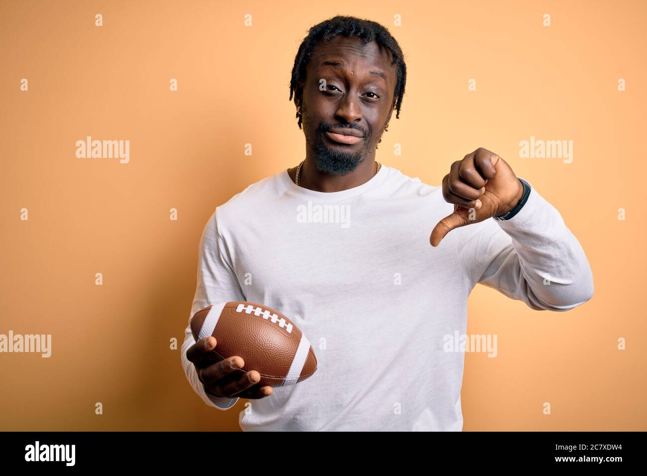 Young african player man playing rugby holding american football ball ...