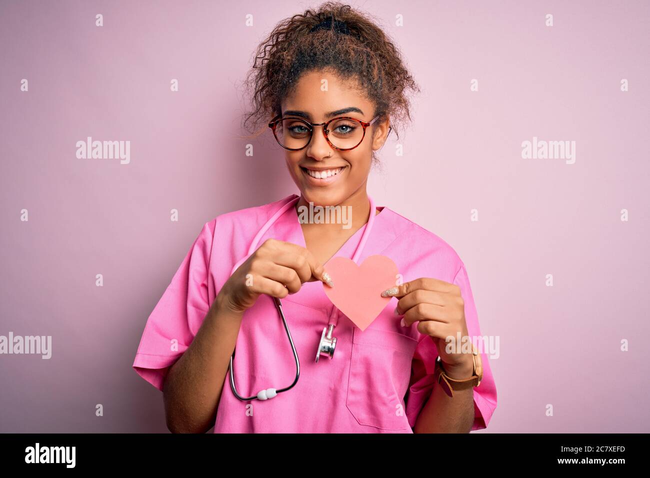 African american cardiologist girl wearing medical uniform and ...