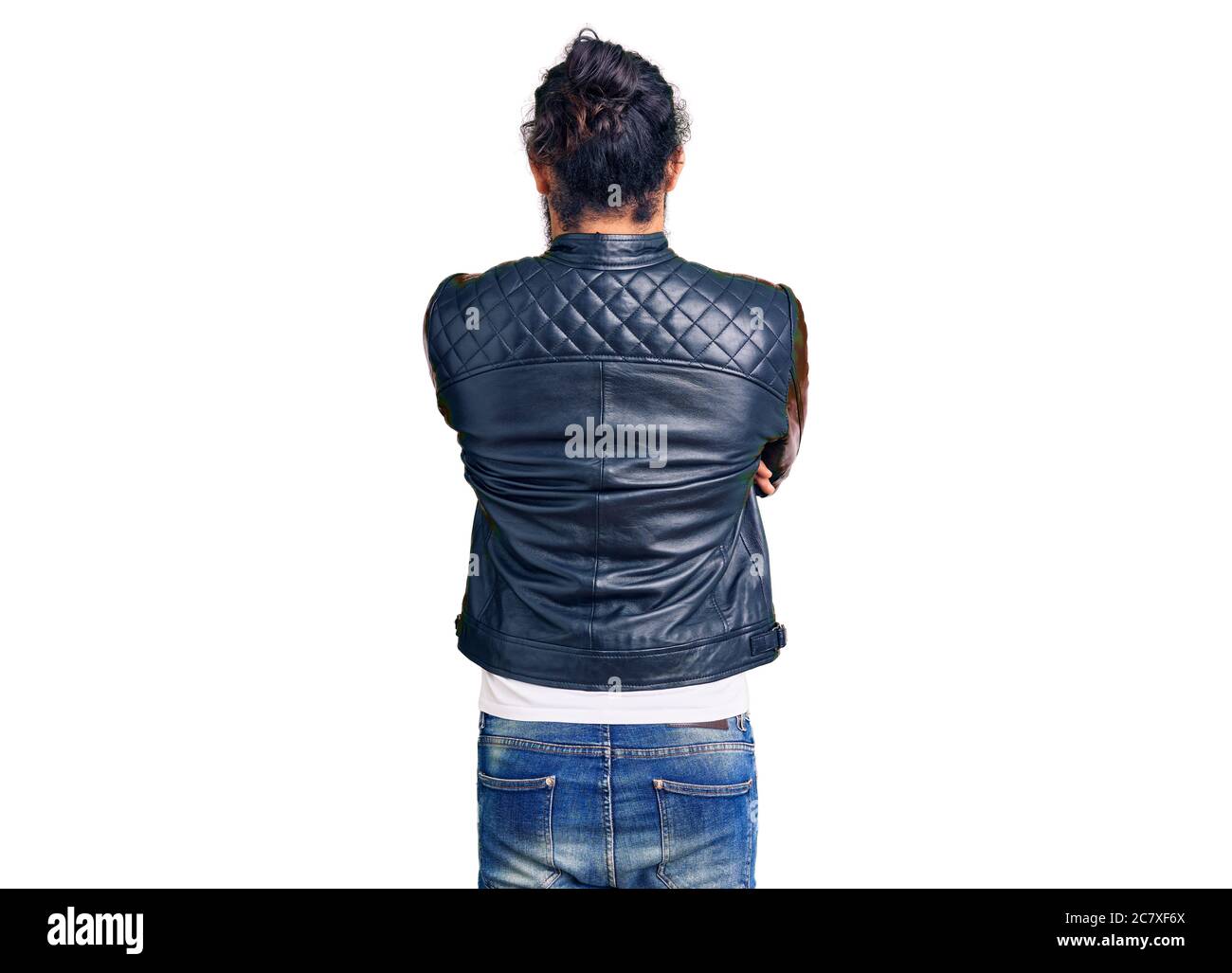 Young arab man wearing casual leather jacket standing backwards looking ...