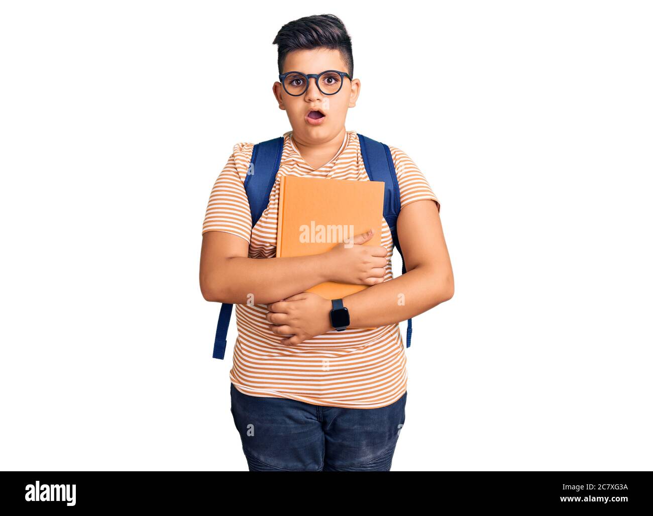 Little boy kid wearing student backpack holding books scared and amazed ...