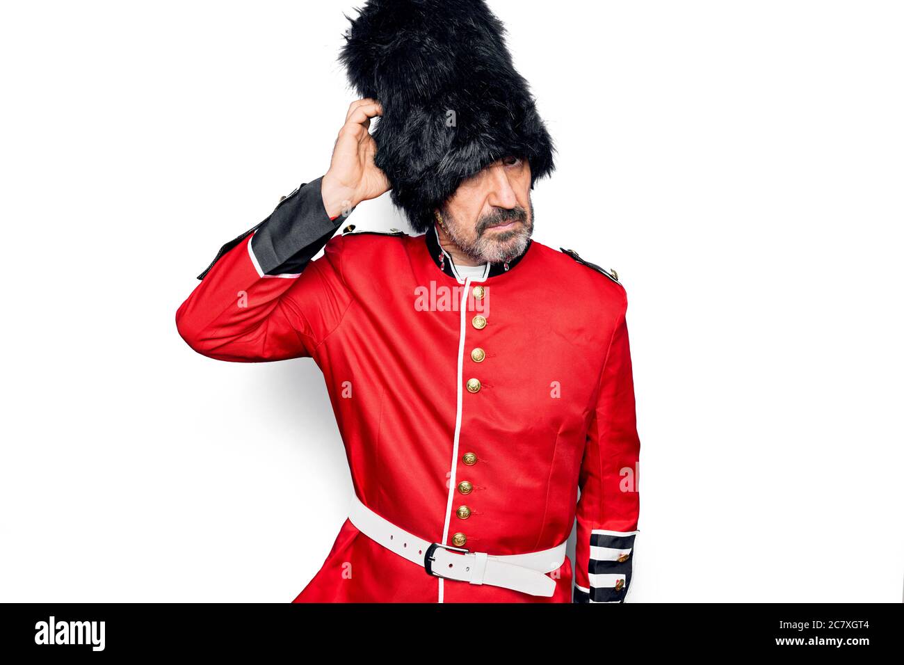 Middle age handsome wales guard man wearing traditional uniform over ...