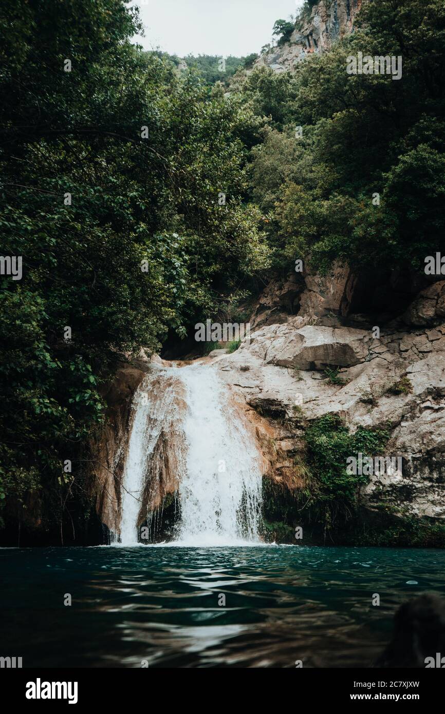 Vertical photo of a high mountain river waterfall Stock Photo - Alamy