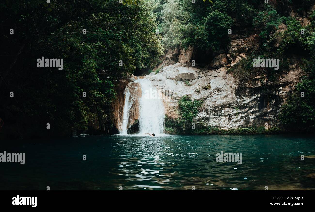 Horizontal photo of a high mountain river pool with a waterfall Stock ...