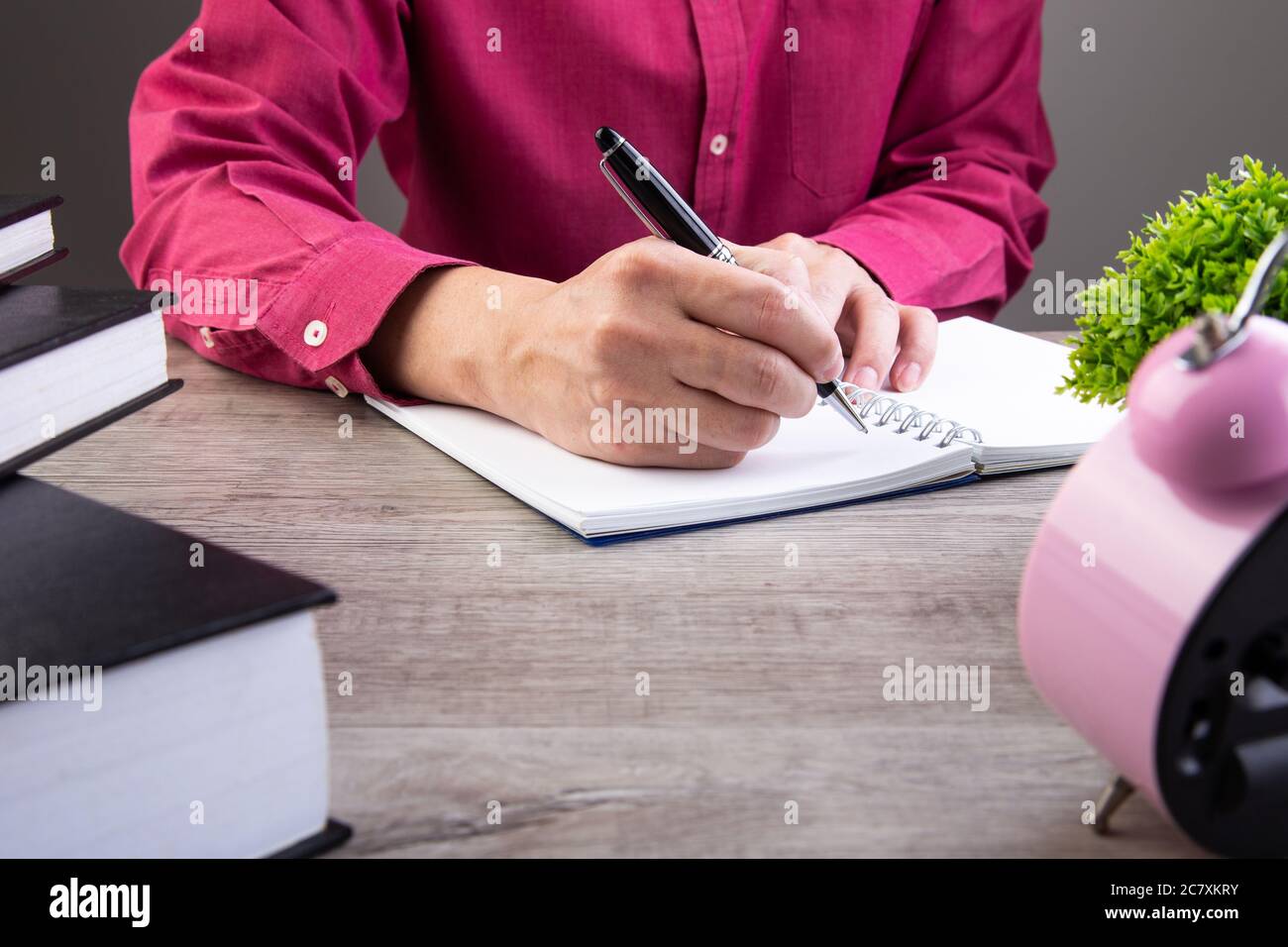 Black male making notes hi-res stock photography and images - Alamy