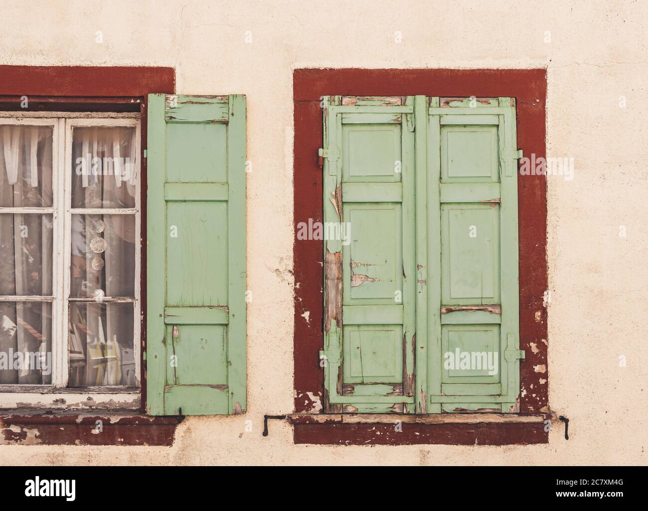 Colorful symmetric rustic windows Stock Photo - Alamy