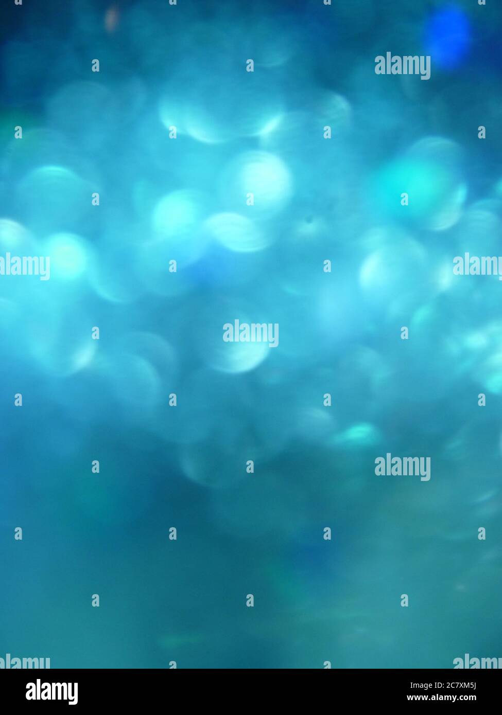 Vertical shot of blue lights under the lens flare effect Stock Photo ...