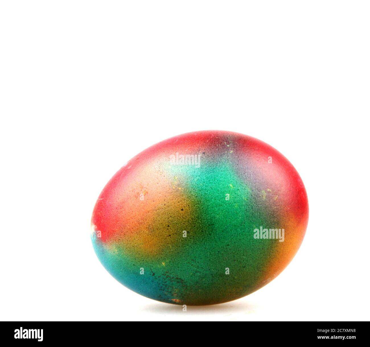 Closeup of an egg painted in different mixed colors for Easter isolated ...