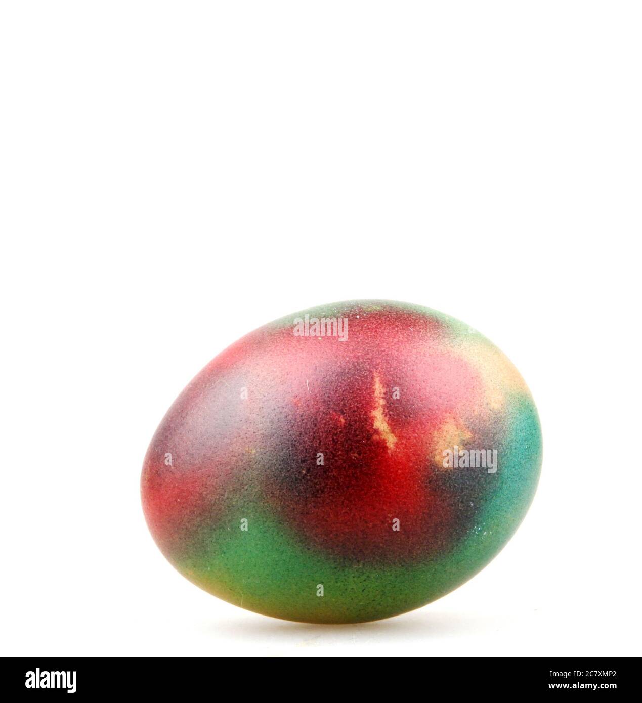 Closeup of an egg painted in different mixed colors for Easter isolated ...
