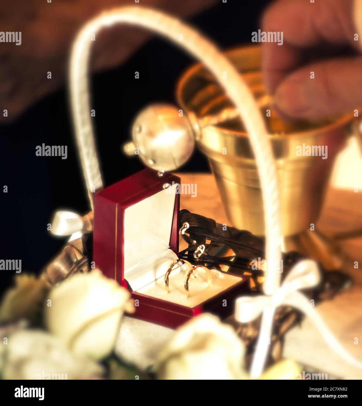 Pastor blessing the golden wedding rings in the ring box Stock Photo ...