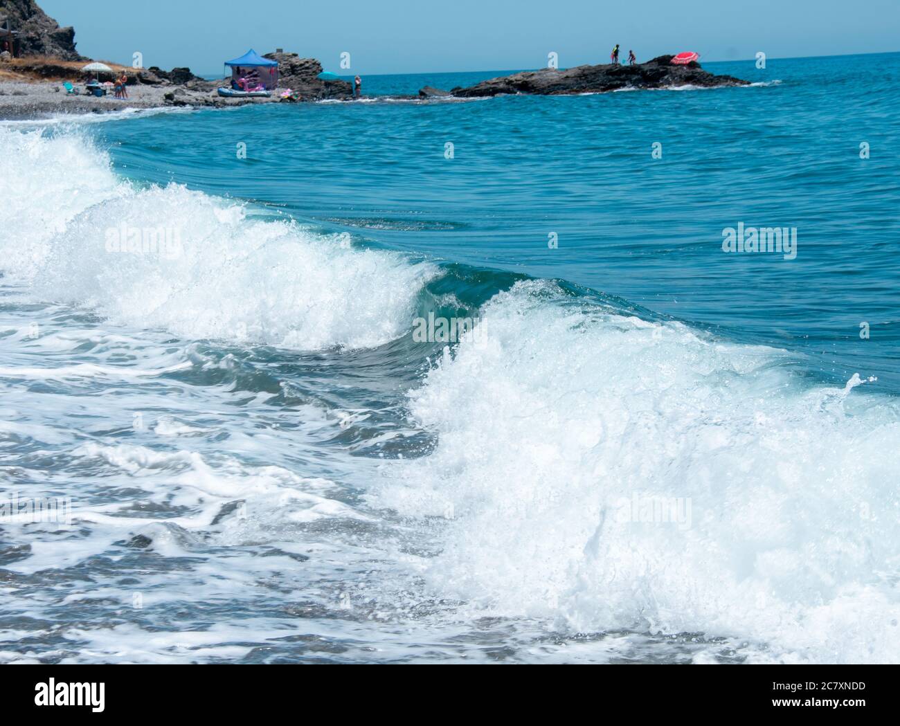 Beautiful scene of splashing waves on seashore under the sunlight Stock ...