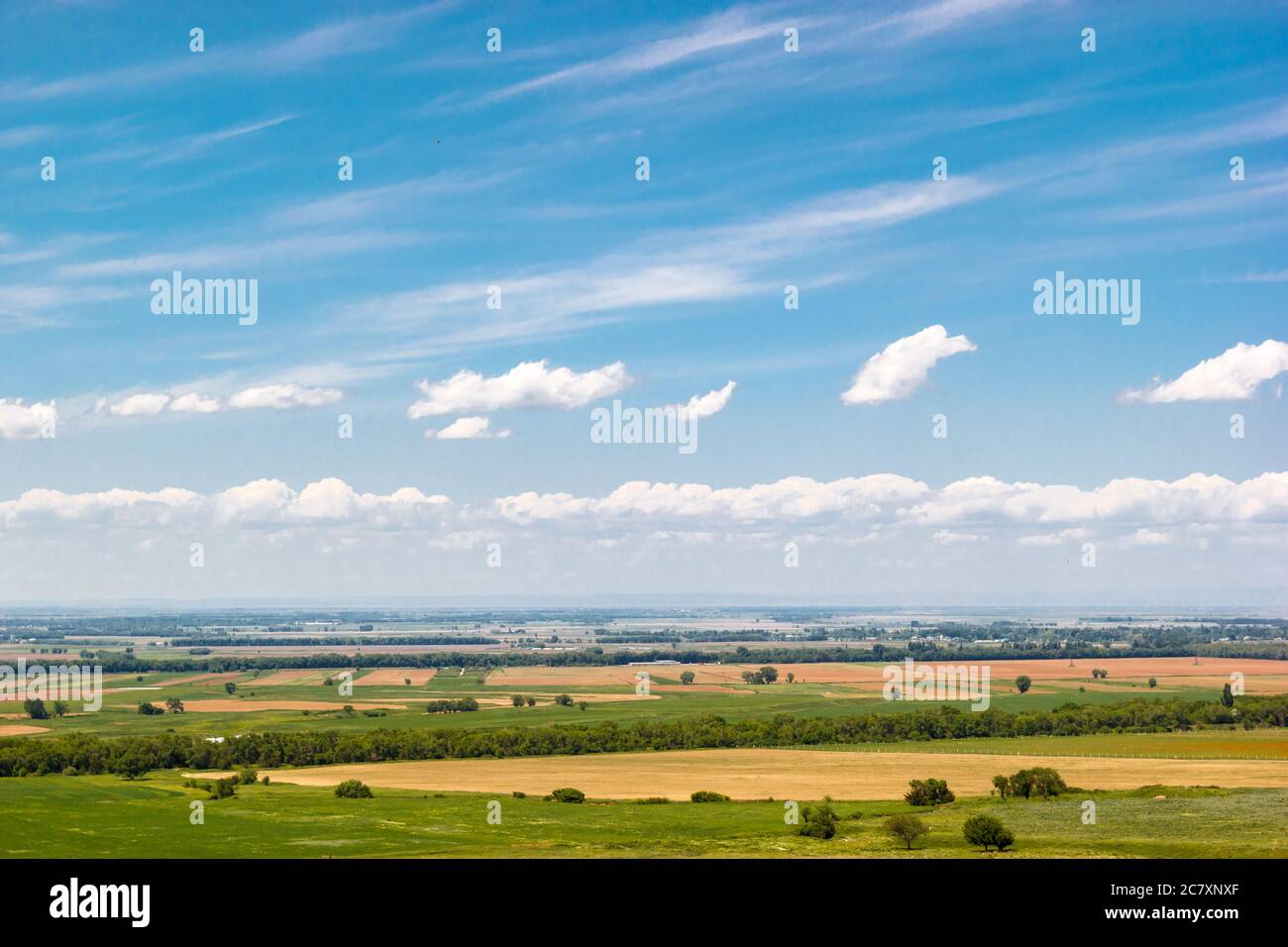 Aerial view of bright landscape against a blue sky with clouds. Skyline ...