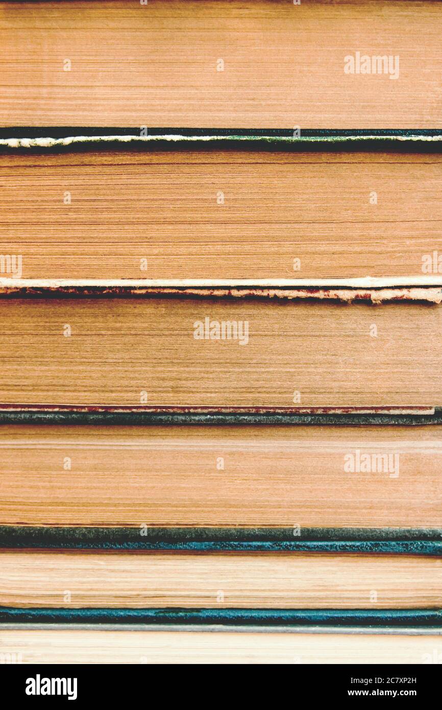 Stack of old used books background. Pile of vintage old hardback books ...