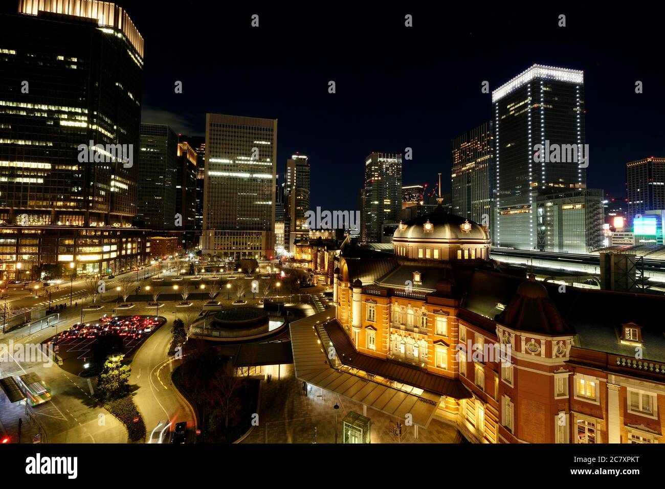 famous railway station in Tokyo at night. perspective and wide angle ...