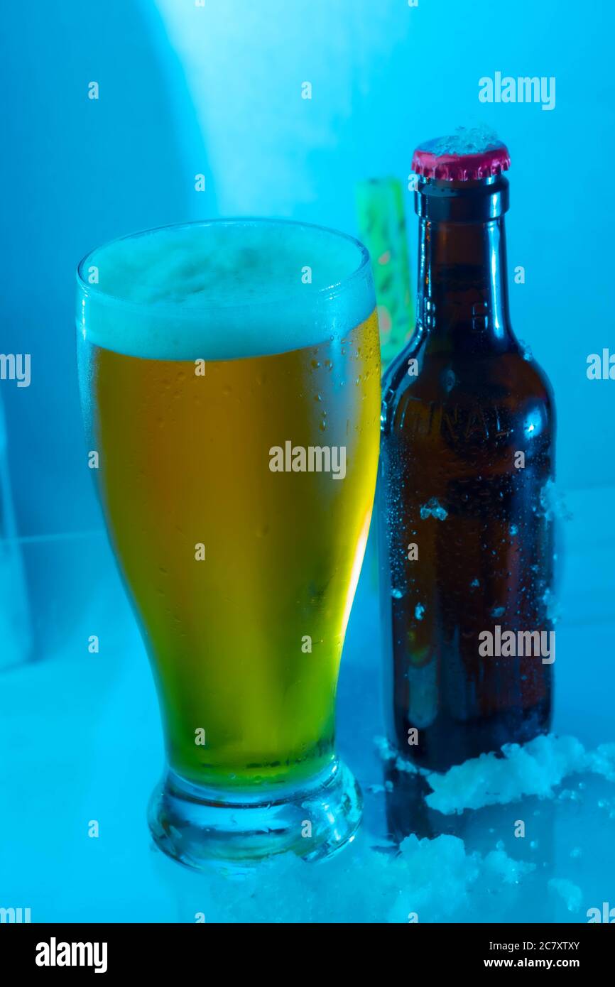 Close up shot of a cold refreshing beer on a transparent table Stock ...