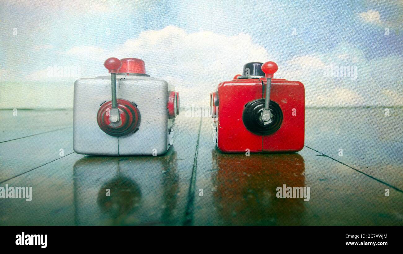 two robot heads chatting on a old wooden floor Stock Photo - Alamy