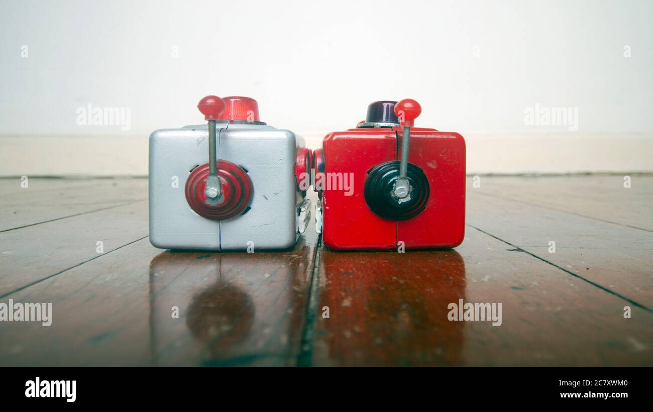 two robot heads chatting on a old wooden floor Stock Photo - Alamy
