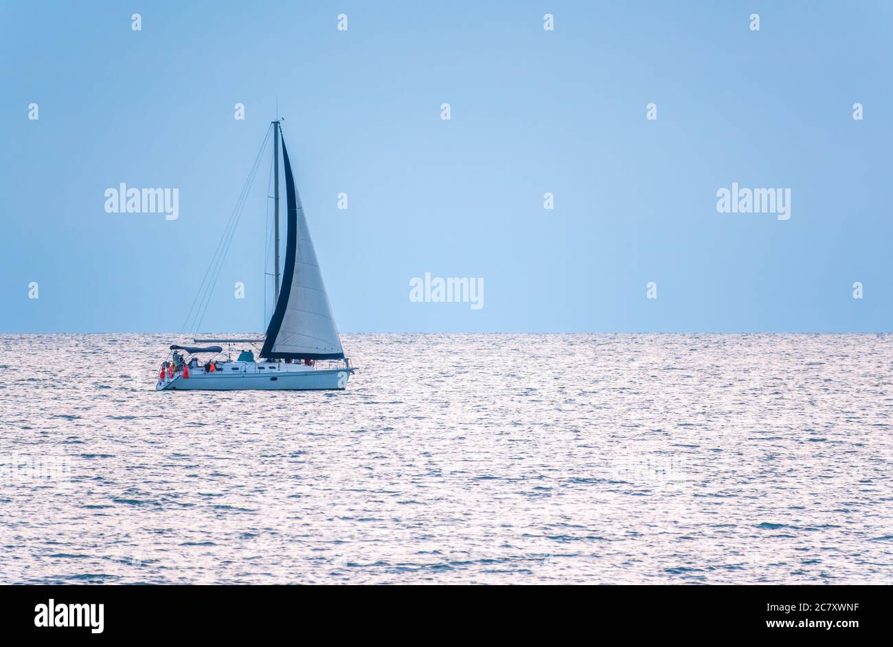 Sailing yacht in the blue calm sea. Yacht in peaceful waters Stock ...