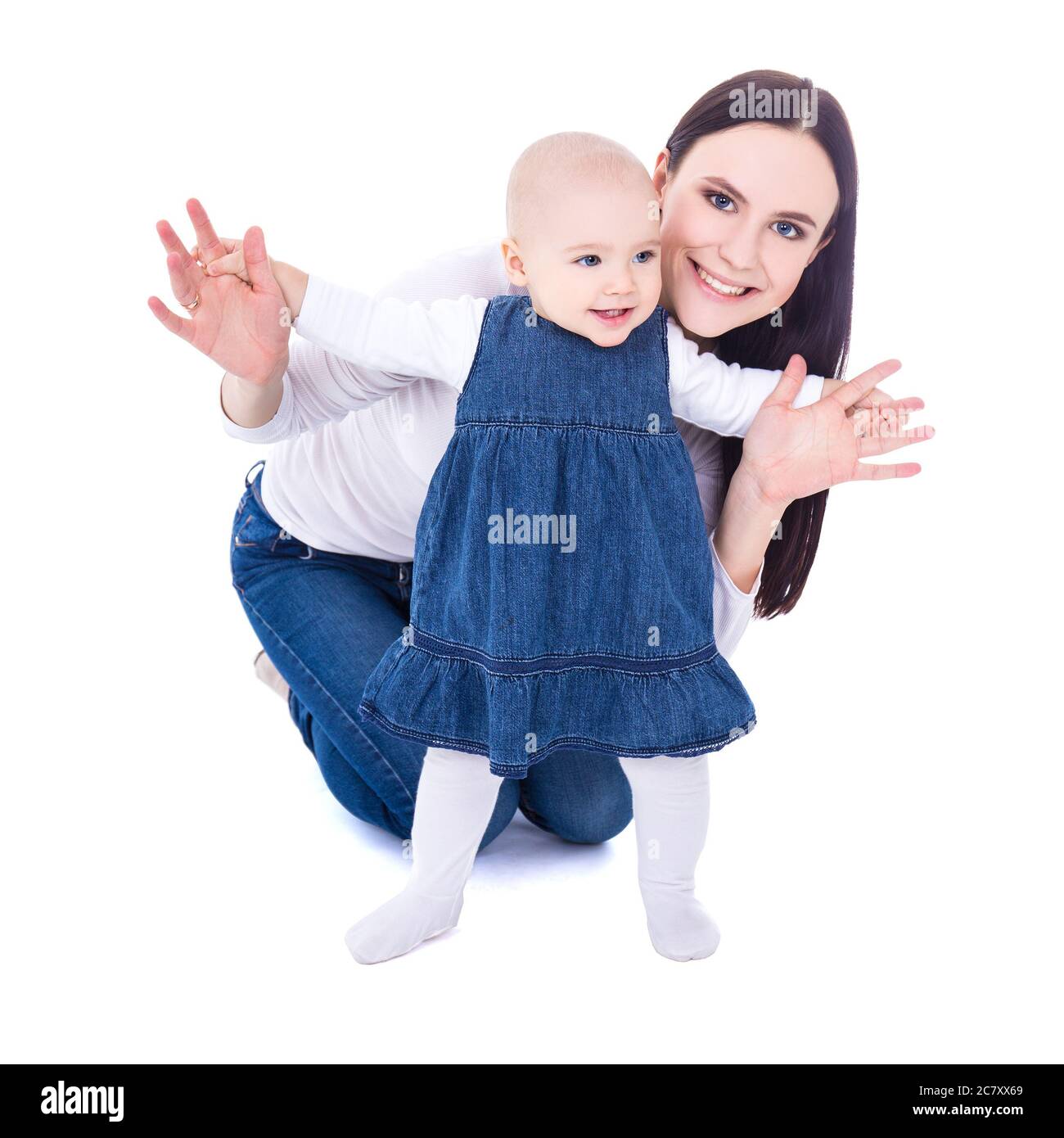 first step concept - young mother with baby girl learning to walk ...