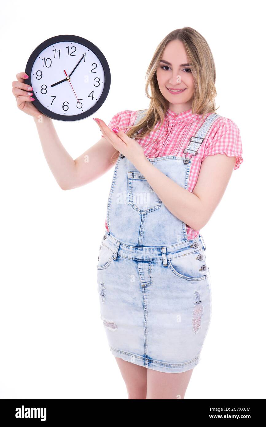 time concept - happy teenage girl pointing at office clock isolated on ...