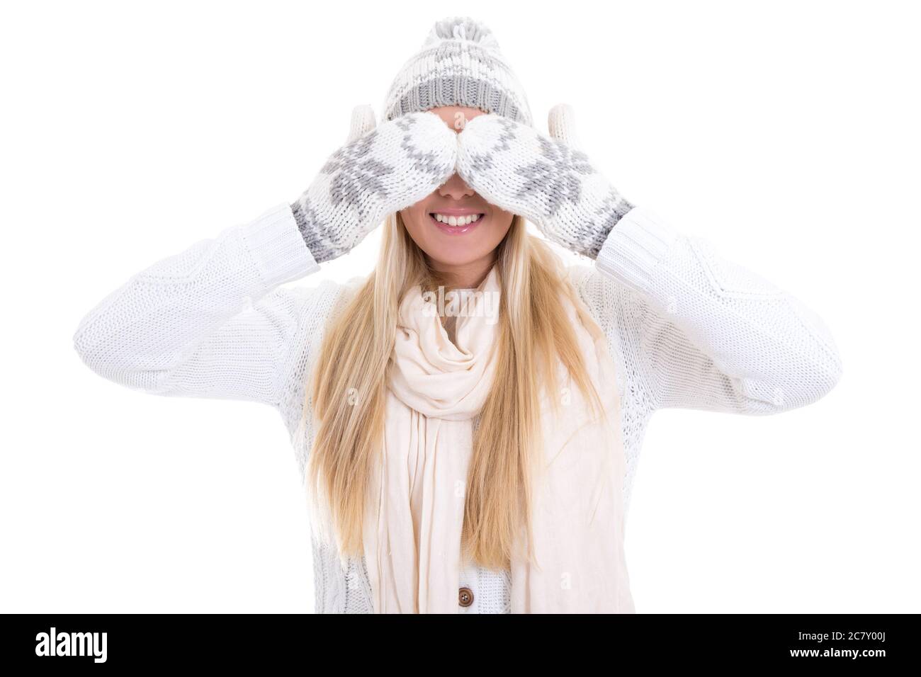 pretty young woman in winter clothes hiding her face isolated on white ...