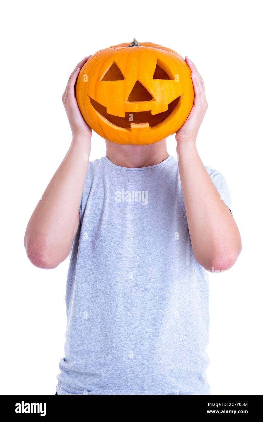 Halloween concept - man covering his face with pumpkin Jack-O-Lantern ...