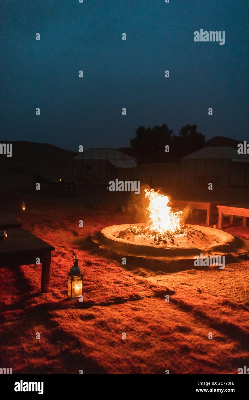Romantic evening in glamping desert camp in Sahara, Morocco with huge campfire Stock Photo - Alamy