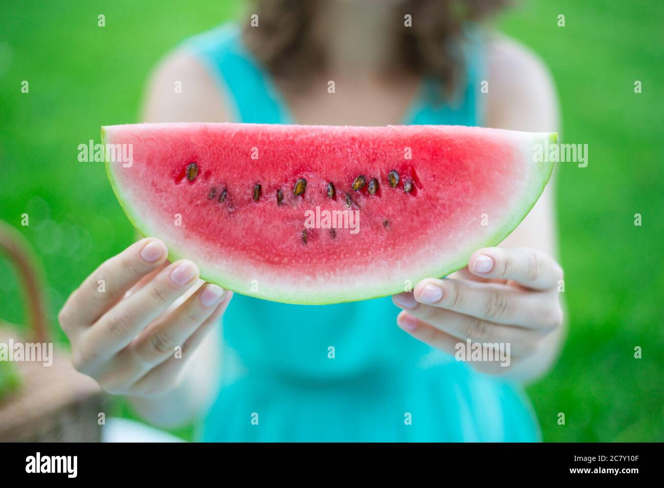 Girl eating piece of watermelon hi-res stock photography and images - Alamy