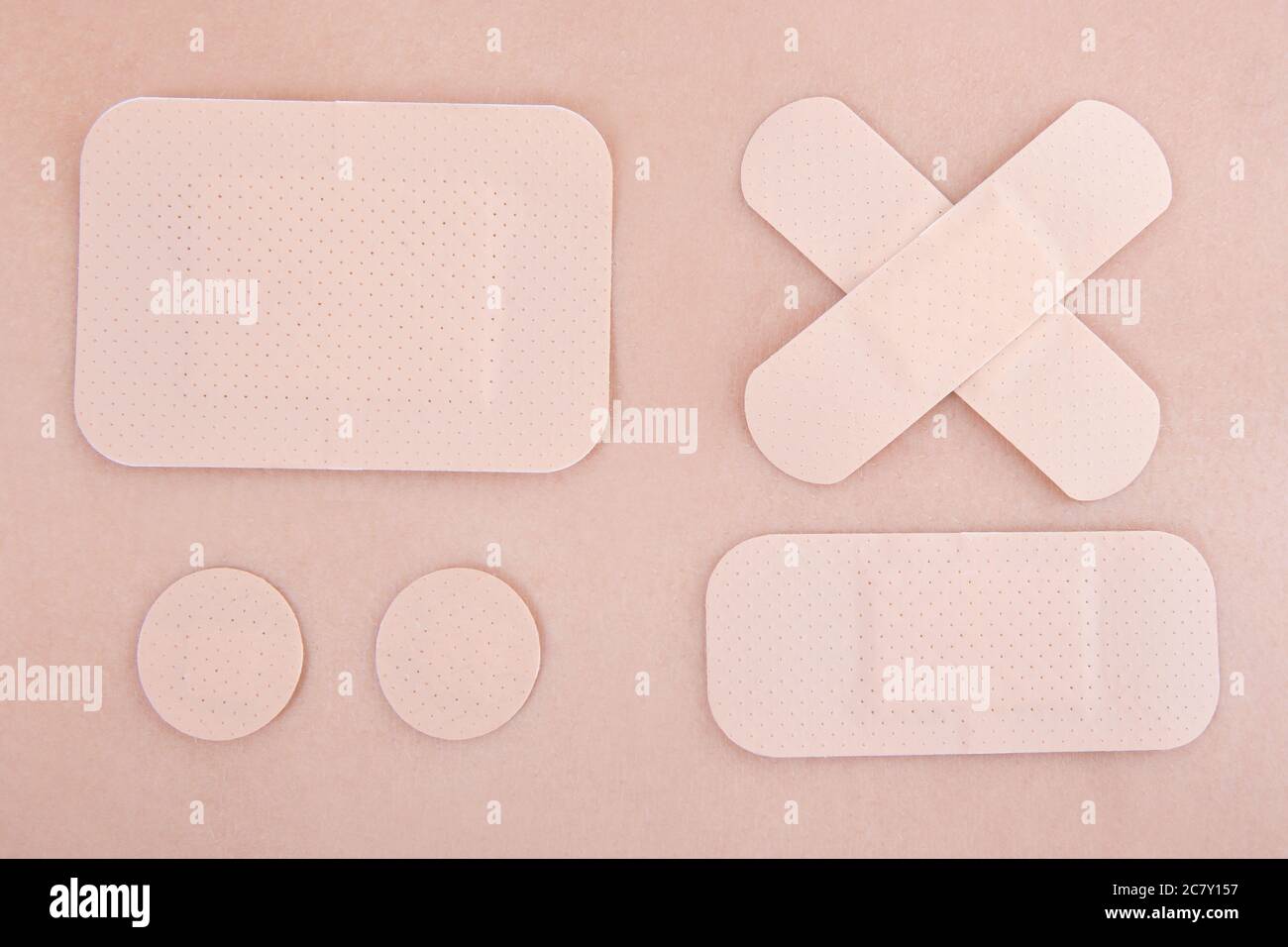 close up of different medical adhesive plasters on skin background ...