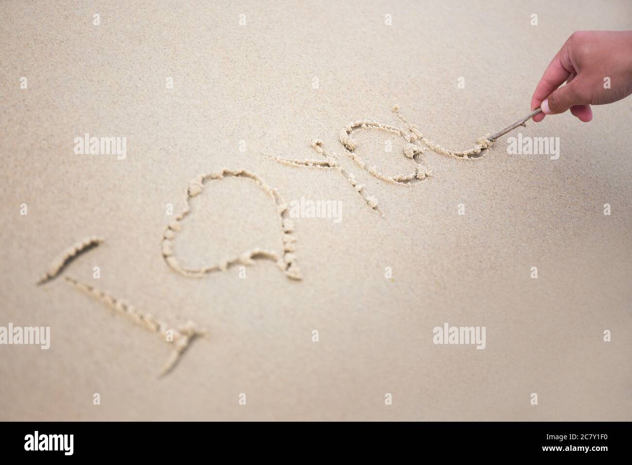 Couple writing sand hi-res stock photography and images - Alamy