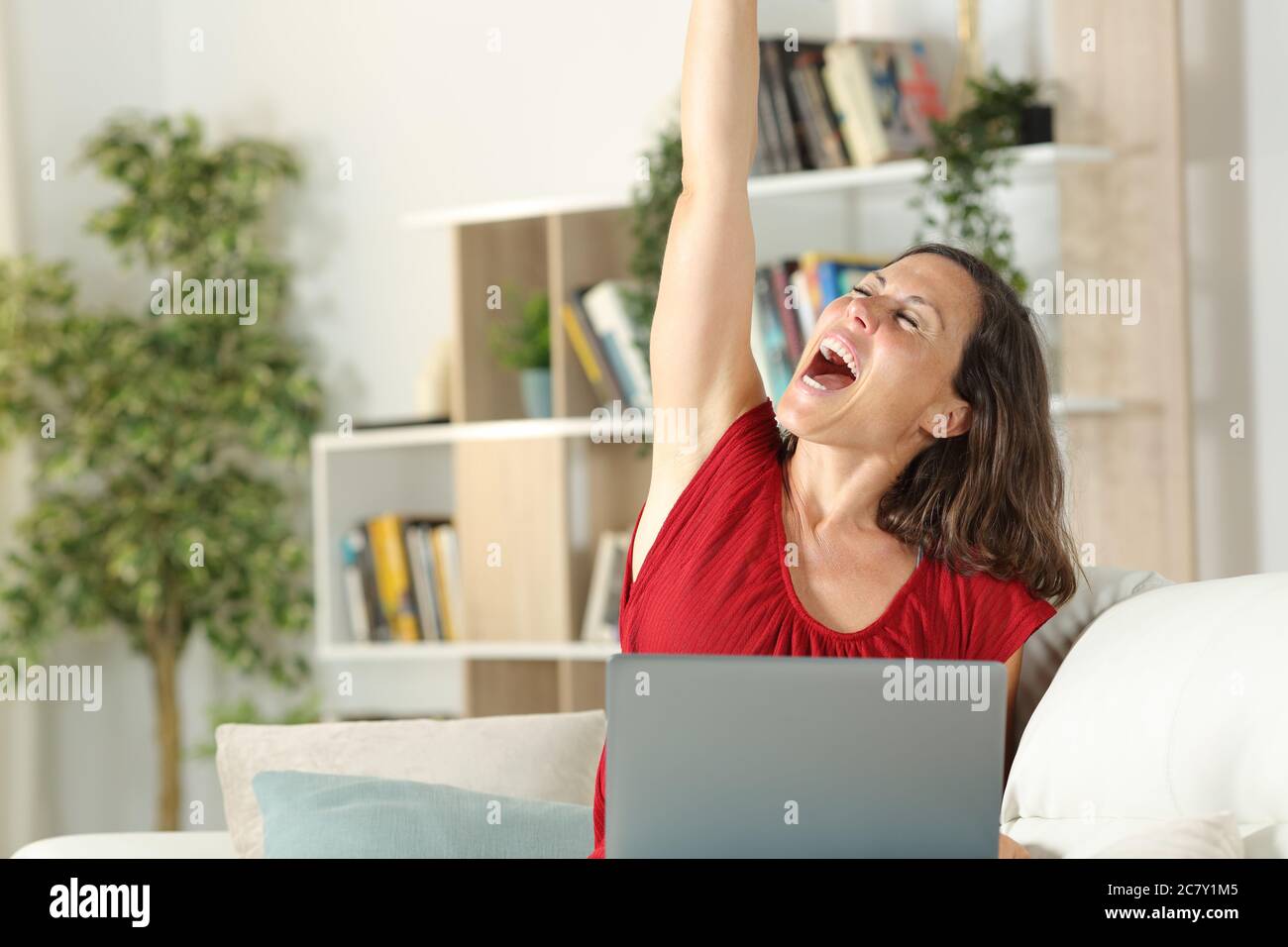 Excited woman computer home hi-res stock photography and images - Alamy