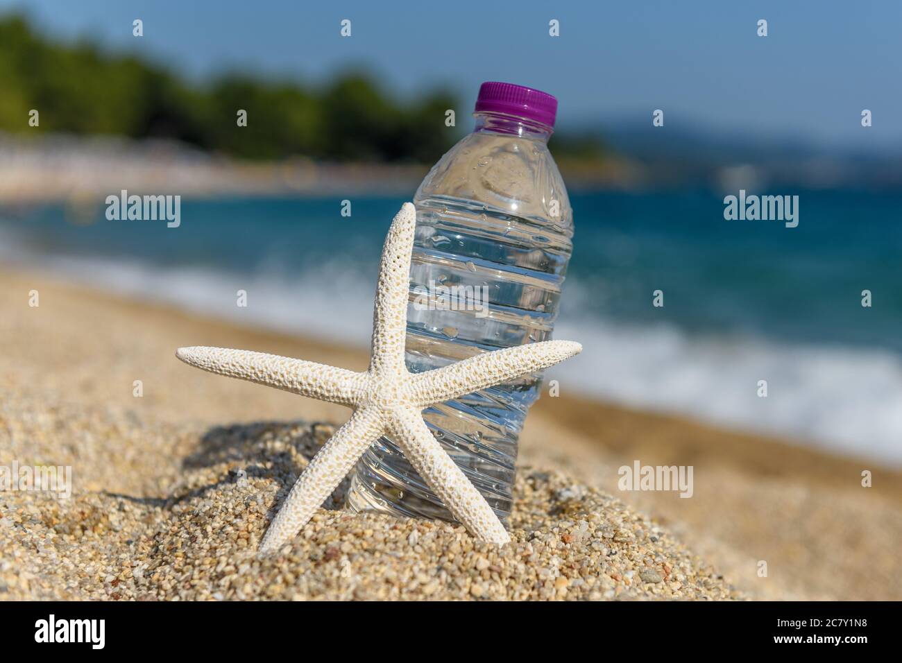 Bottle of cold fresh water on beach sand. Summer concept Stock Photo ...