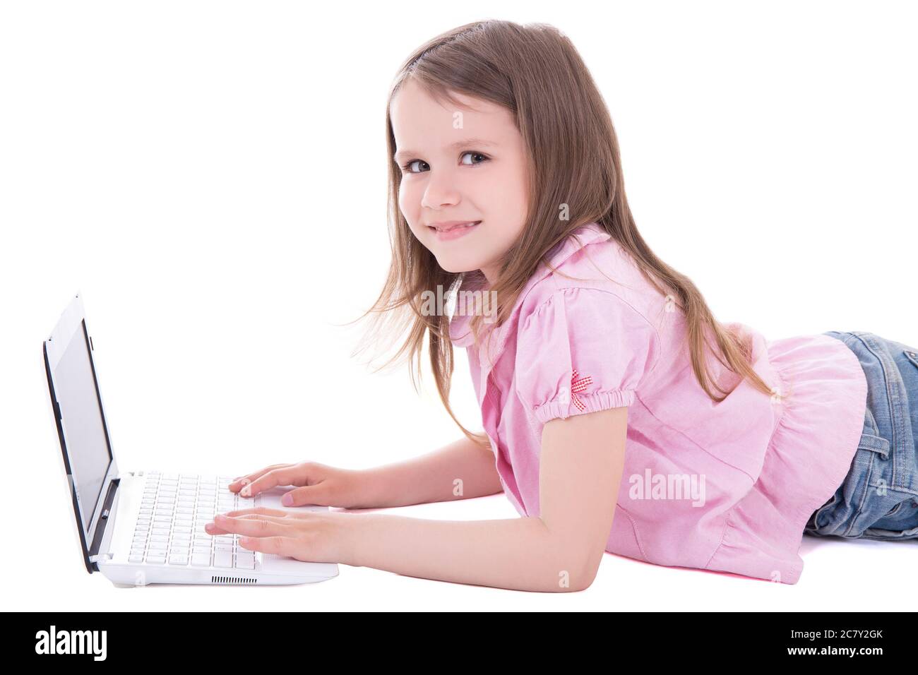 happy cute little girl with computer isolated on white background Stock ...