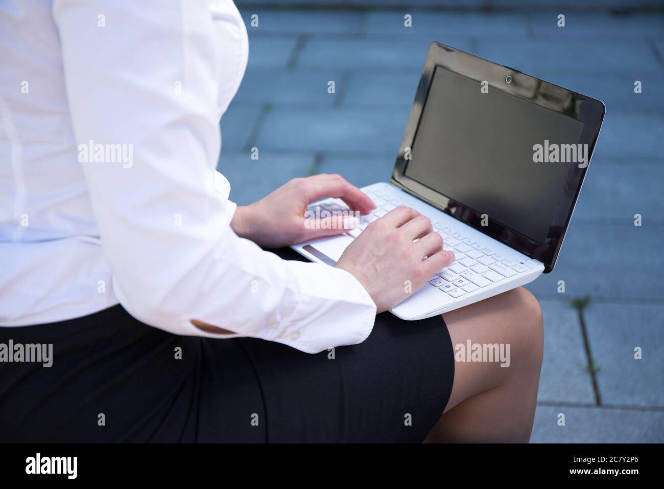 young business woman using computer in city park Stock Photo - Alamy