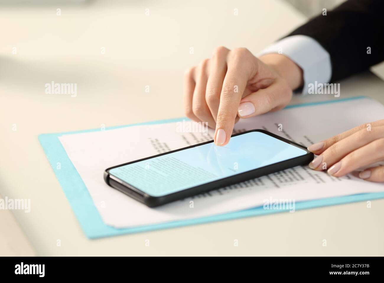 Close up of executive hands signing digital contract on phone screen ...