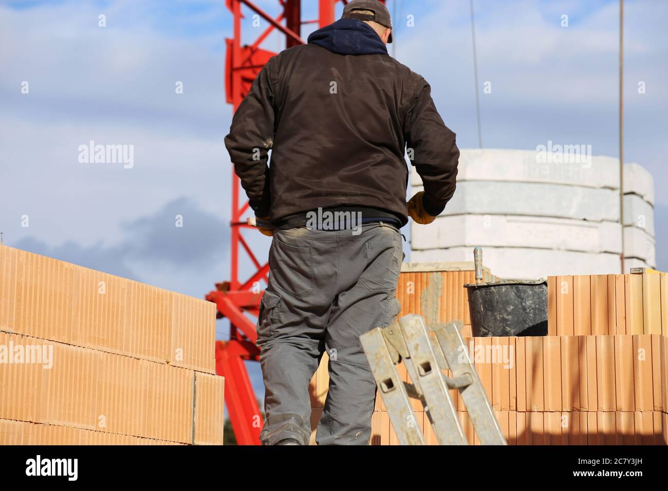 Construction worker (bricklayer) works on the construction site Stock ...