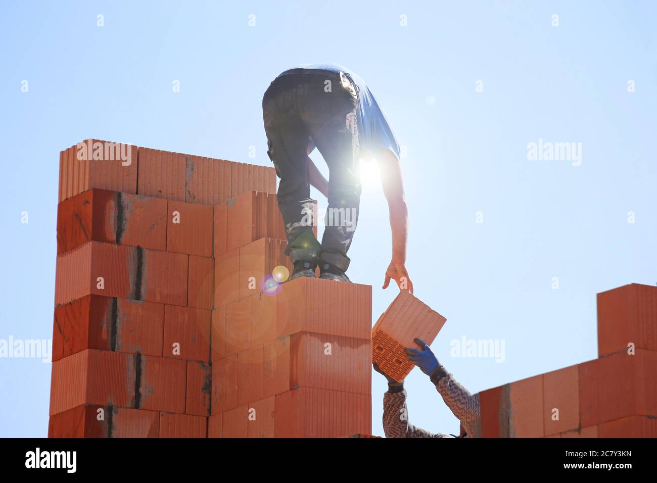 Construction worker (bricklayer) works on the construction site Stock ...