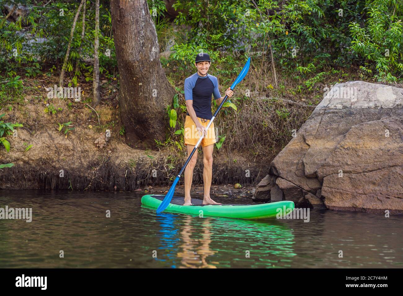 Man on paddleboard in a river hi-res stock photography and images - Alamy