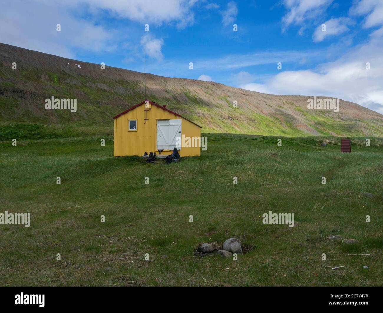 View on latrar camp site in adalvik cove with yellow emergency shelter ...