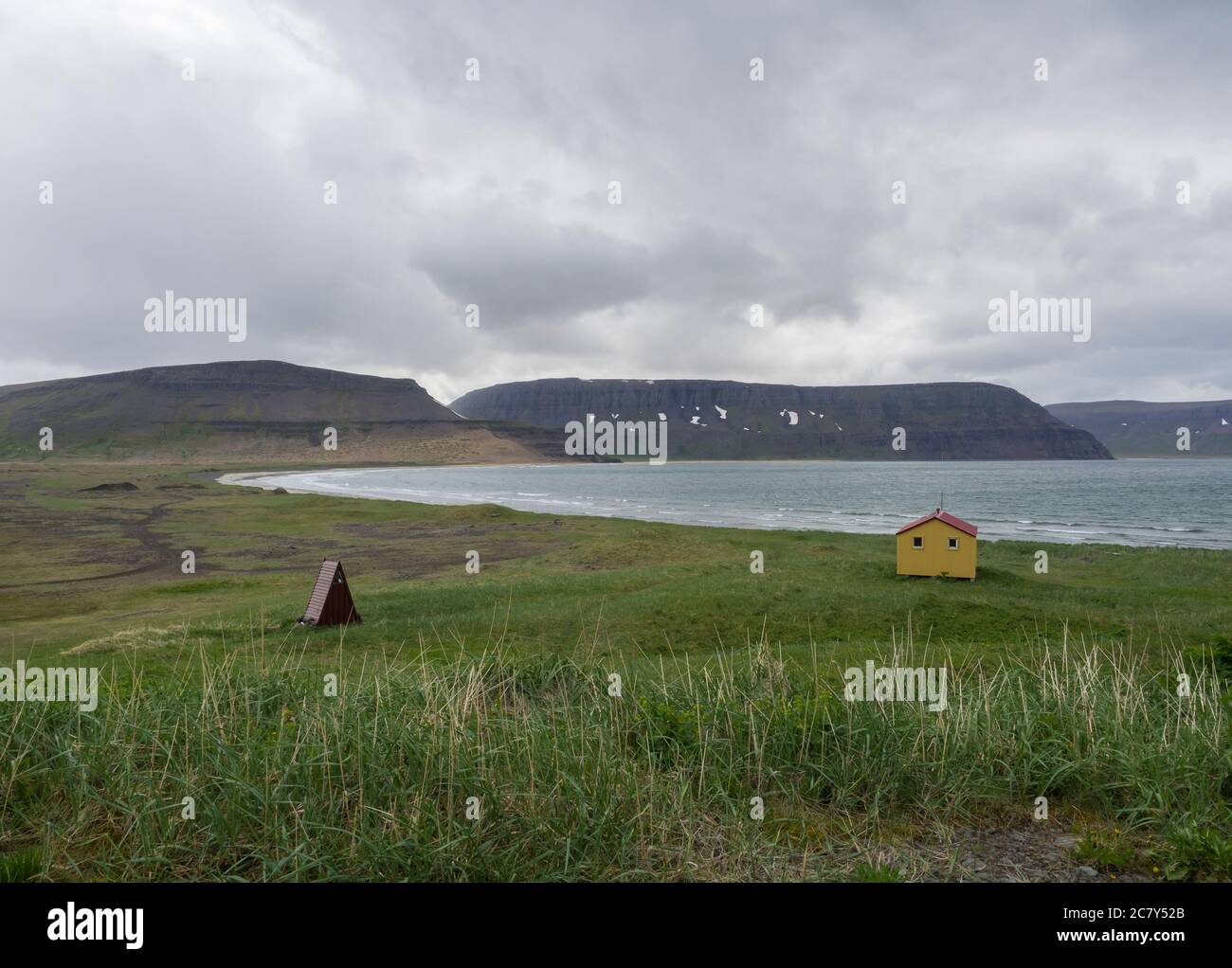 View on latrar camp site in adalvik cove with yellow emergency shelter ...