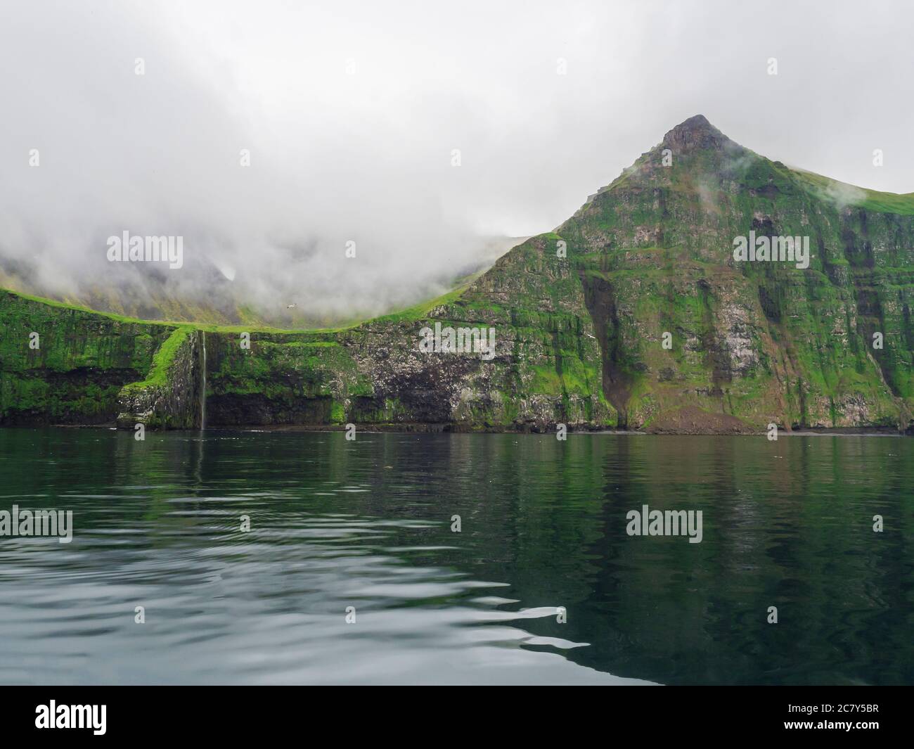 steep green Hornbjarg cliffs and waterfall, biggest bird cliffs in ...