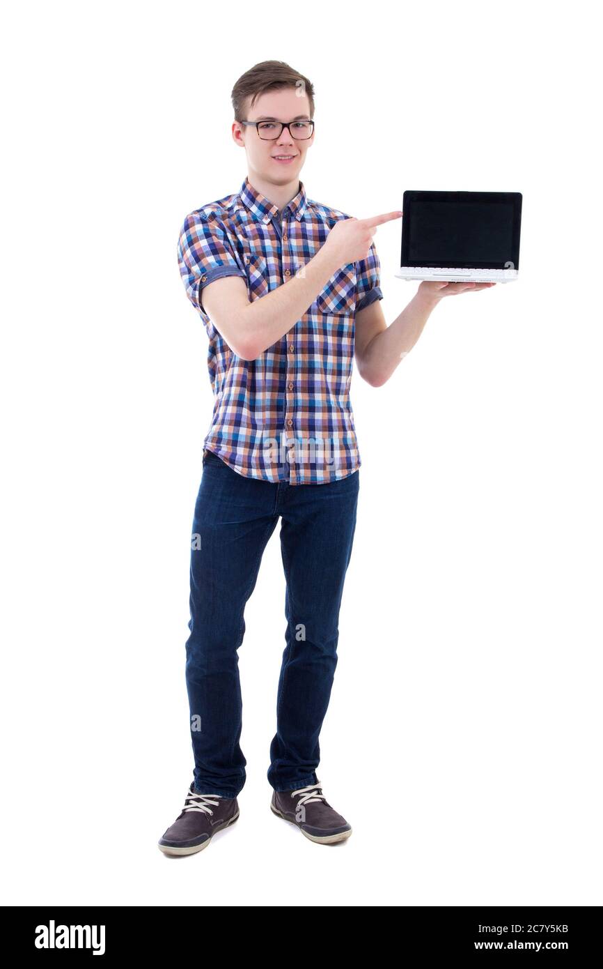 handsome teenage boy holding laptop with blank screen isolated on white ...