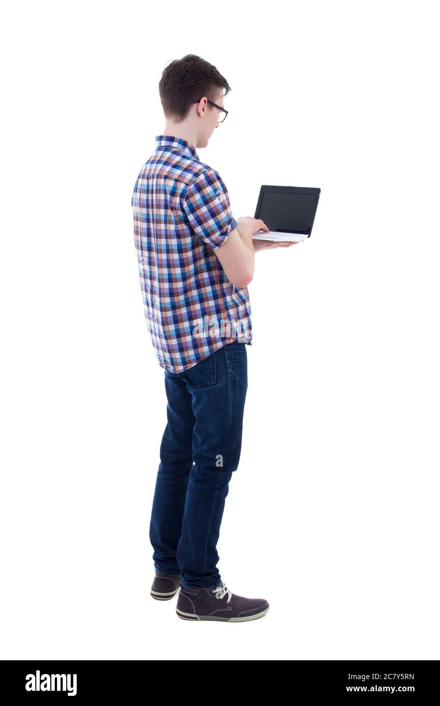 back view of teenage boy holding laptop with blank screen isolated on ...