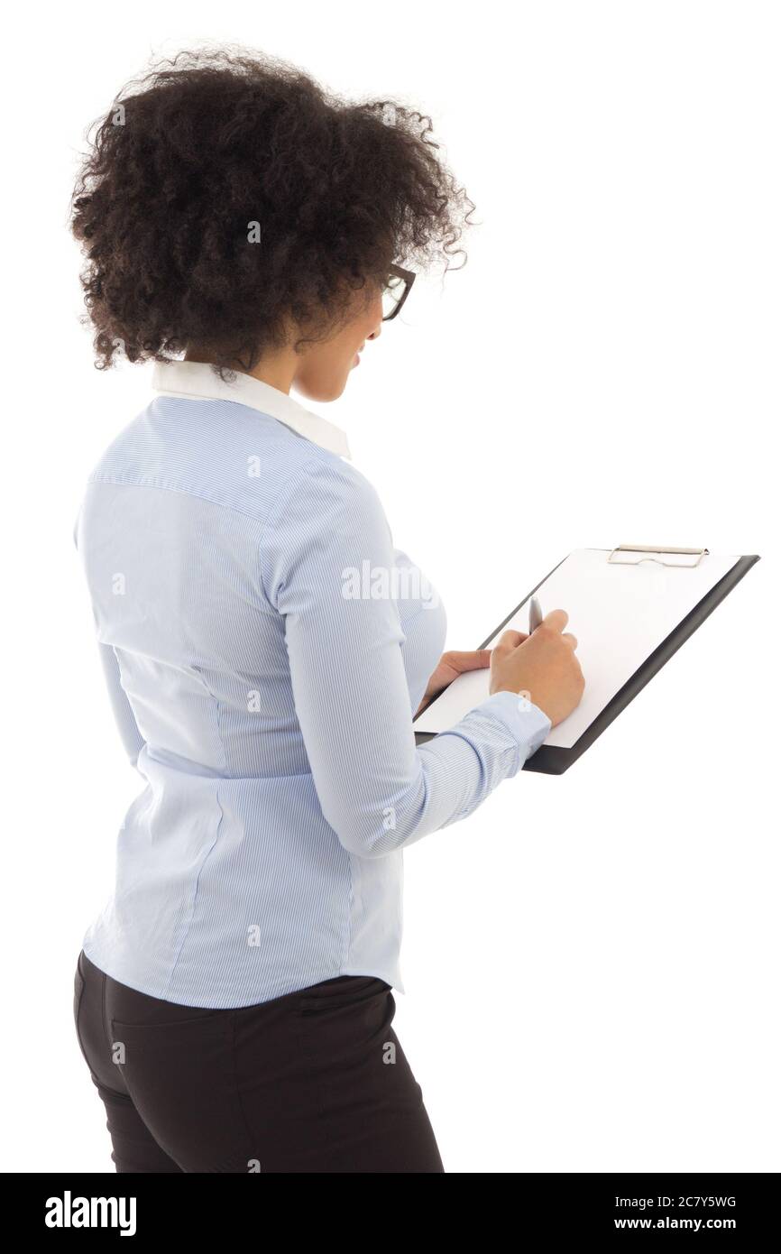 back view of young beautiful african american woman writing something ...