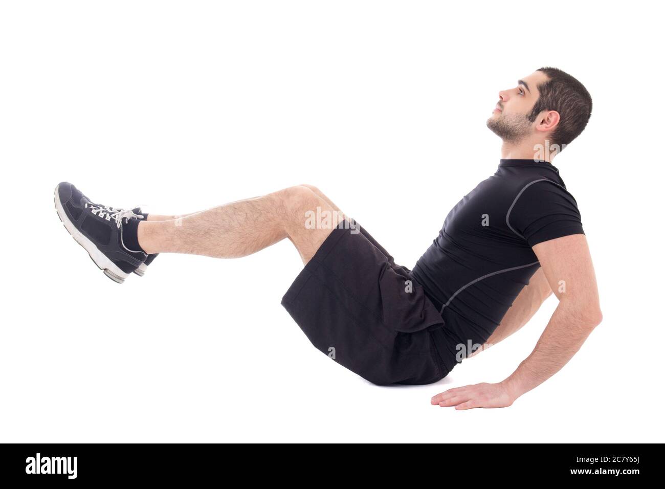 handsome bearded arabic man in sportswear doing exercises for abdominal ...