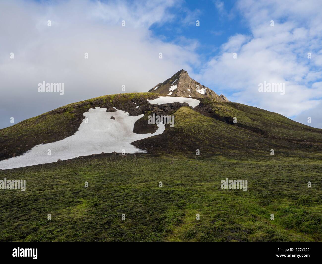 Landscape with snow capped mountain peak pyramide shape in central ...