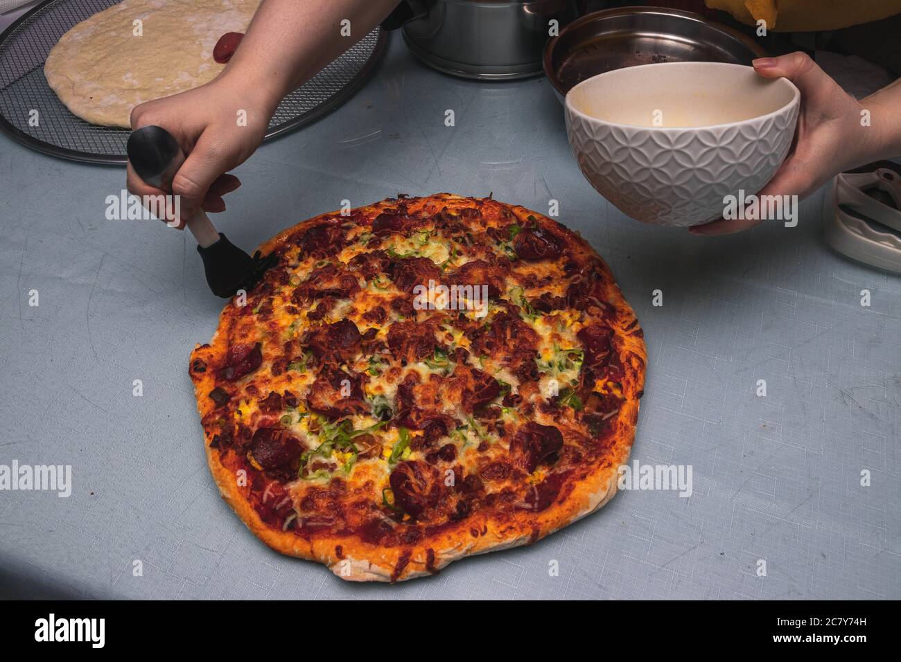 Female cook putting the finishing touches on a delicious homemade ...