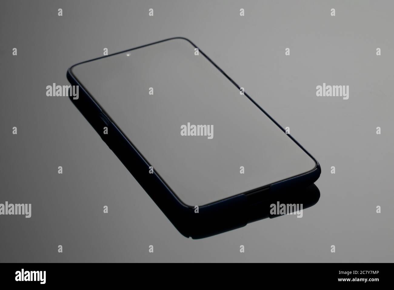 Black large screen smartphone with shadow on glass surface Stock Photo ...
